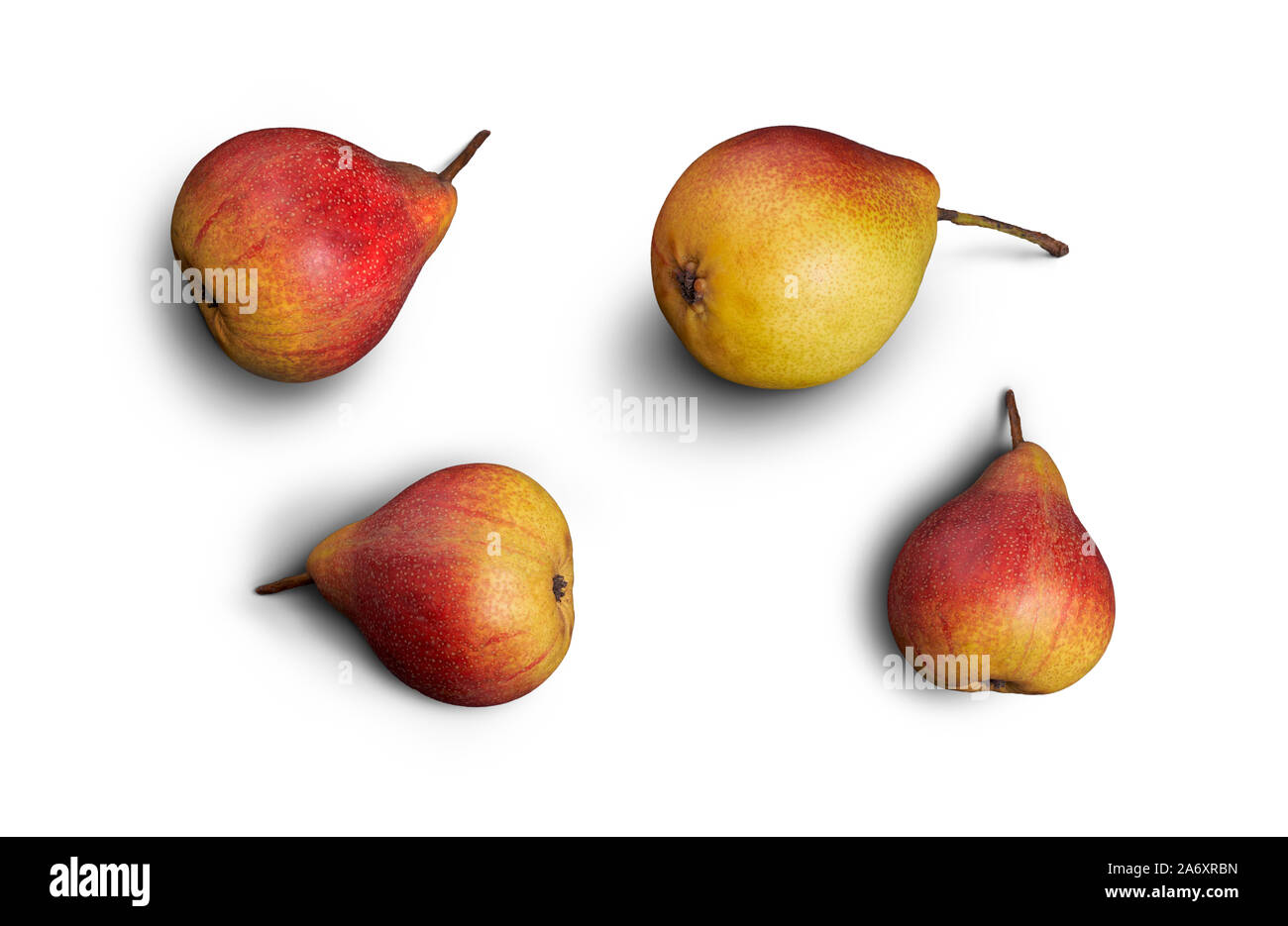A collection of ripe juicy golden red pears isolated against a white ...