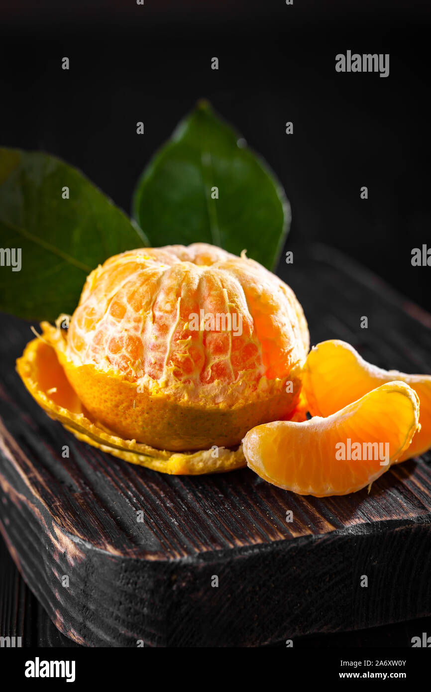 Tangerines on an old fashioned country table. Selective focus. Vertical ...