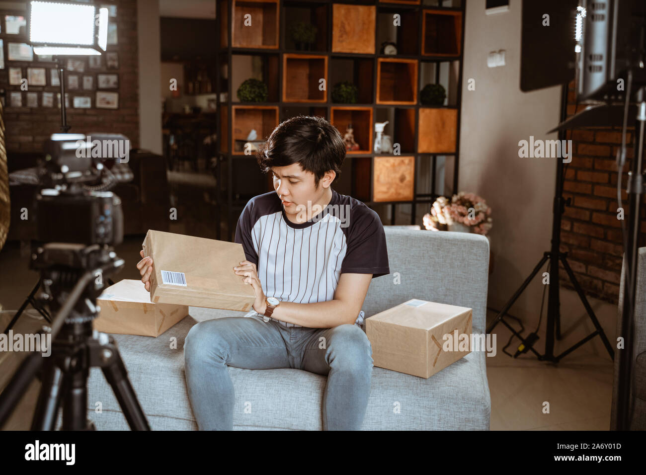 asian young man vlogger recording new vlog about unboxing review Stock ...