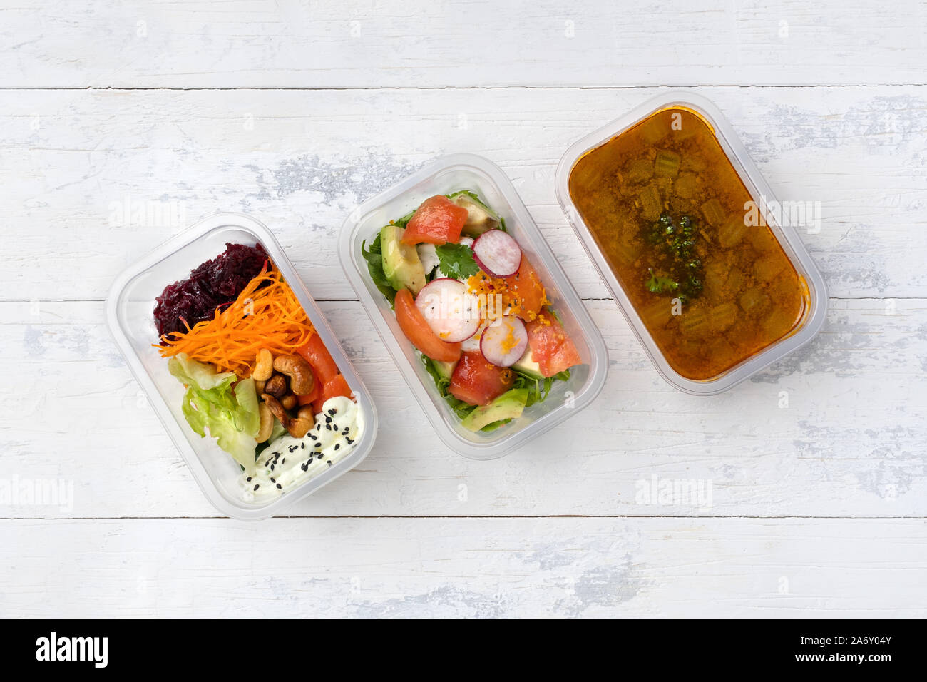 view of three fast food dishes in plastic boxes Stock Photo - Alamy