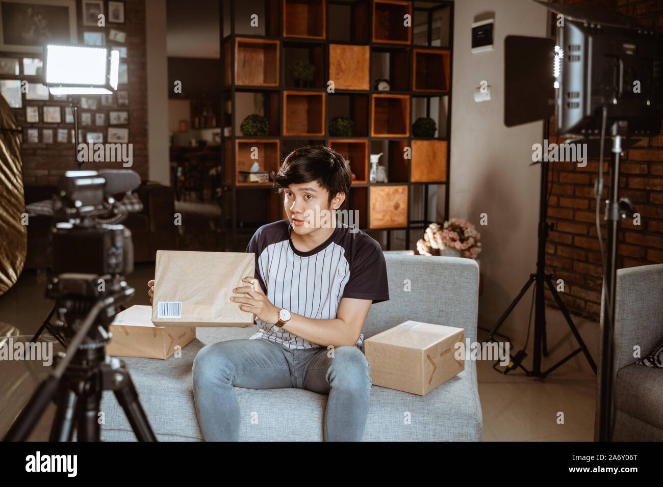 Asian young man making unboxing review recording video for vlog Stock ...