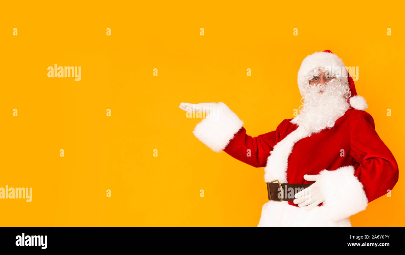 Santa Claus presenting with hand copy space for Christmas text Stock ...