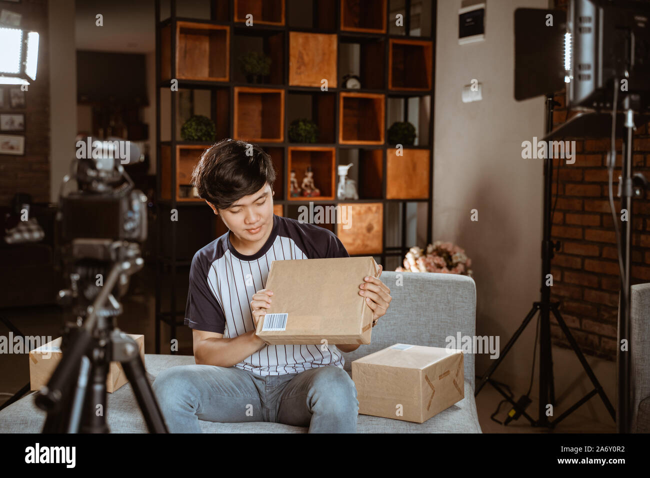 asian young man vlogger recording new vlog about unboxing review Stock ...