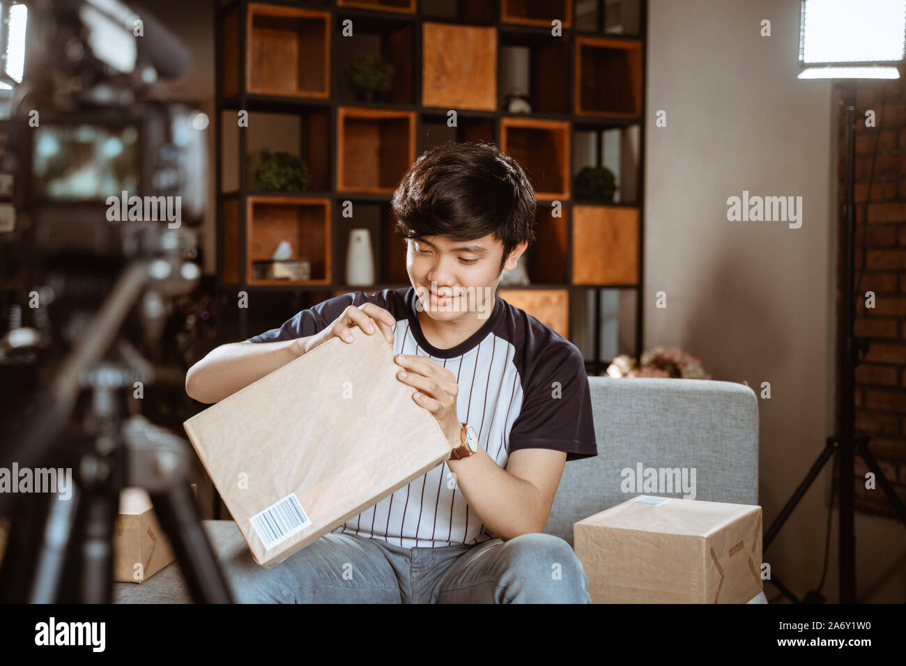 asian young man vlogger recording new vlog about unboxing review Stock ...
