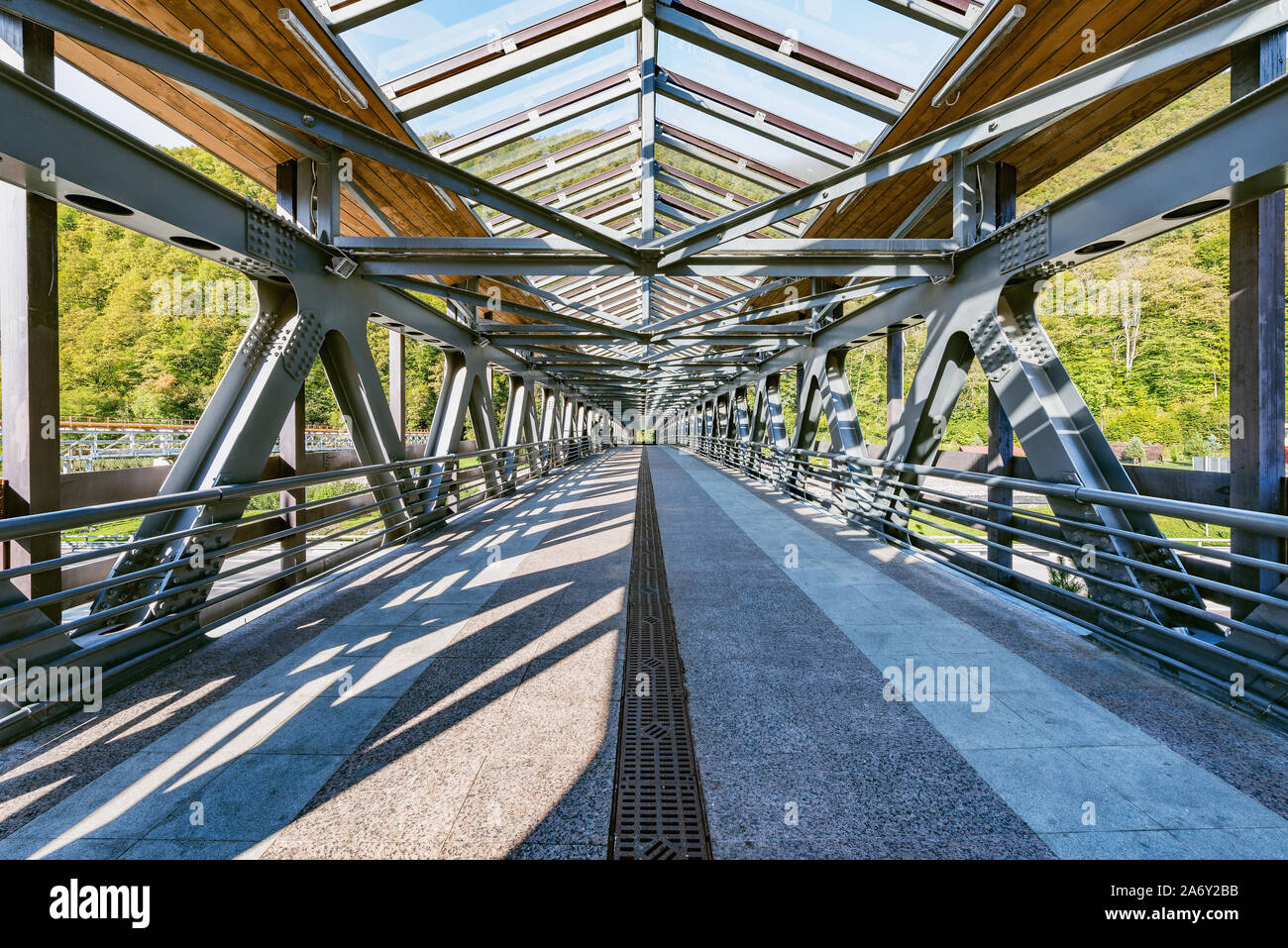 Metal corridor above the highway at sunny day time Stock Photo - Alamy