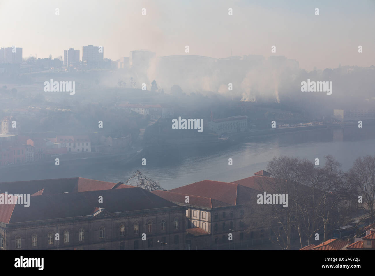 Fire and thick smoke over river Douro. Panorama of the city Porto ...