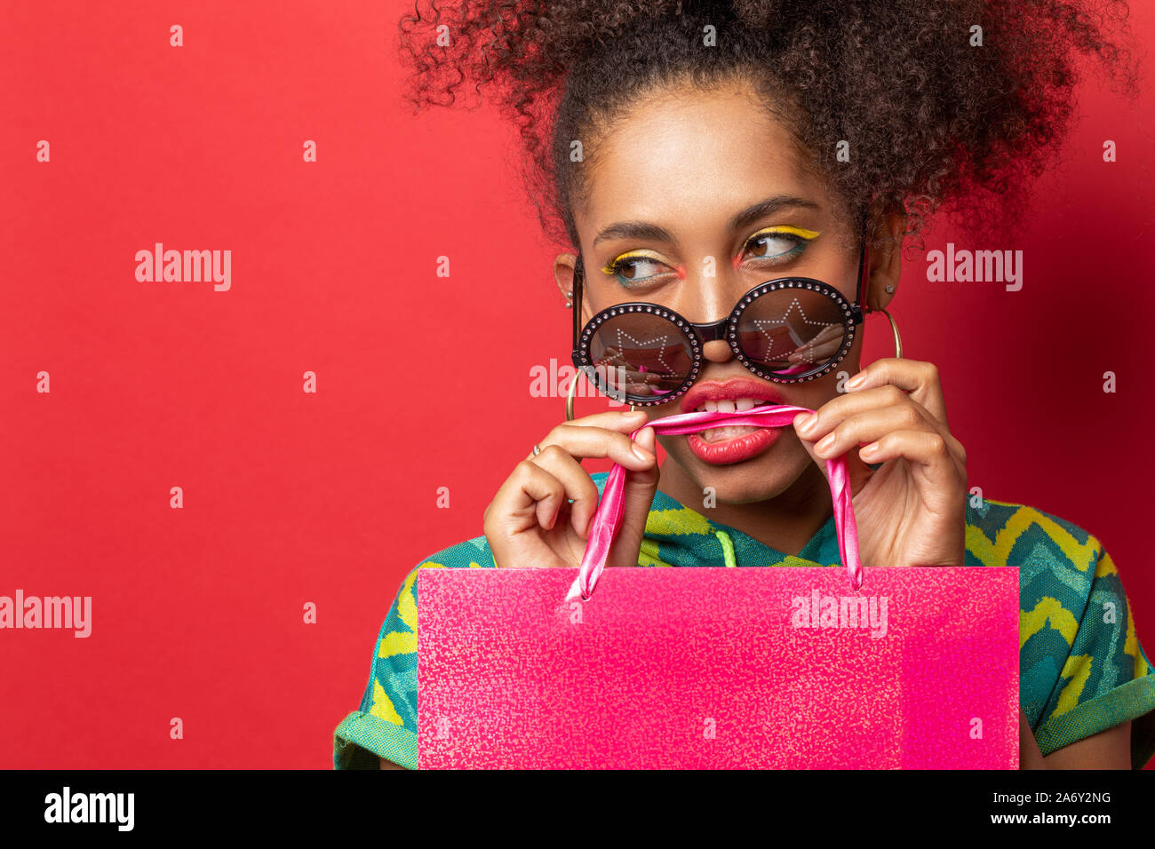girl with a package in his mouth Stock Photo - Alamy
