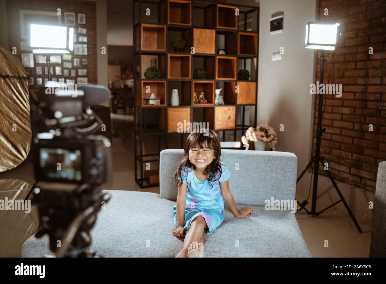 little girl blogger make review using the camera on foreground Stock ...