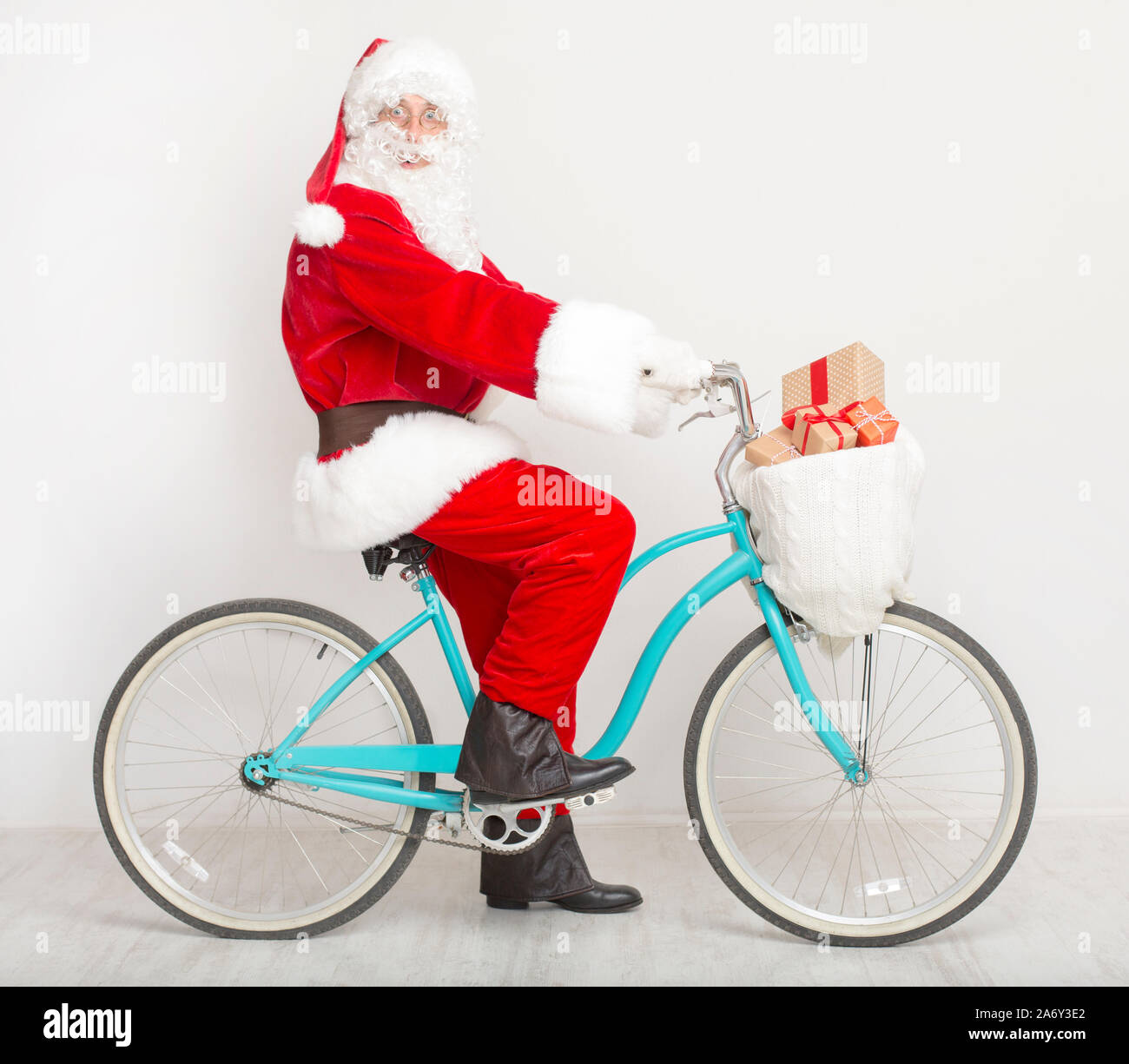 Santa riding a bike hi-res stock photography and images - Alamy