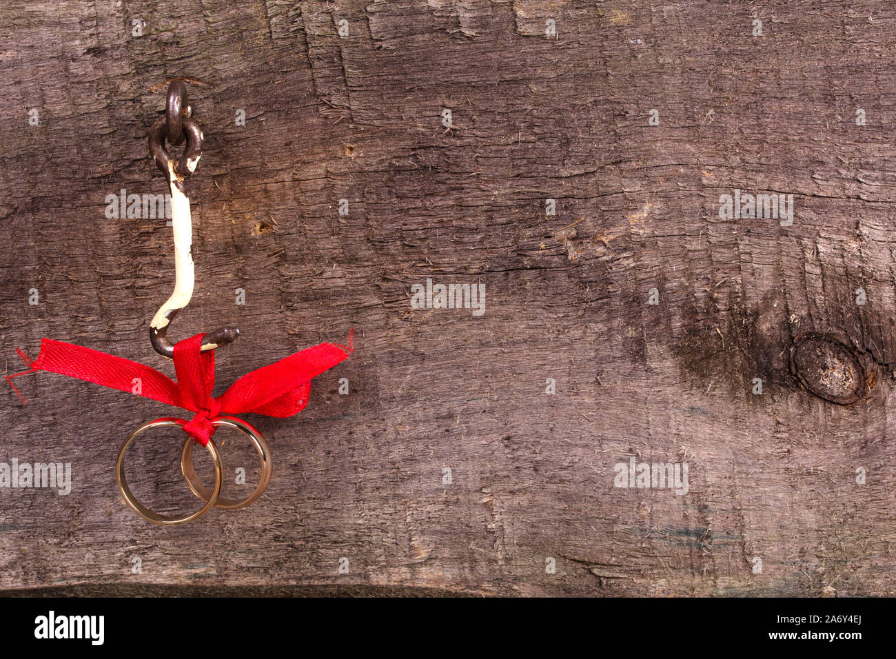 Two wedding rings hanging on a hook Stock Photo - Alamy