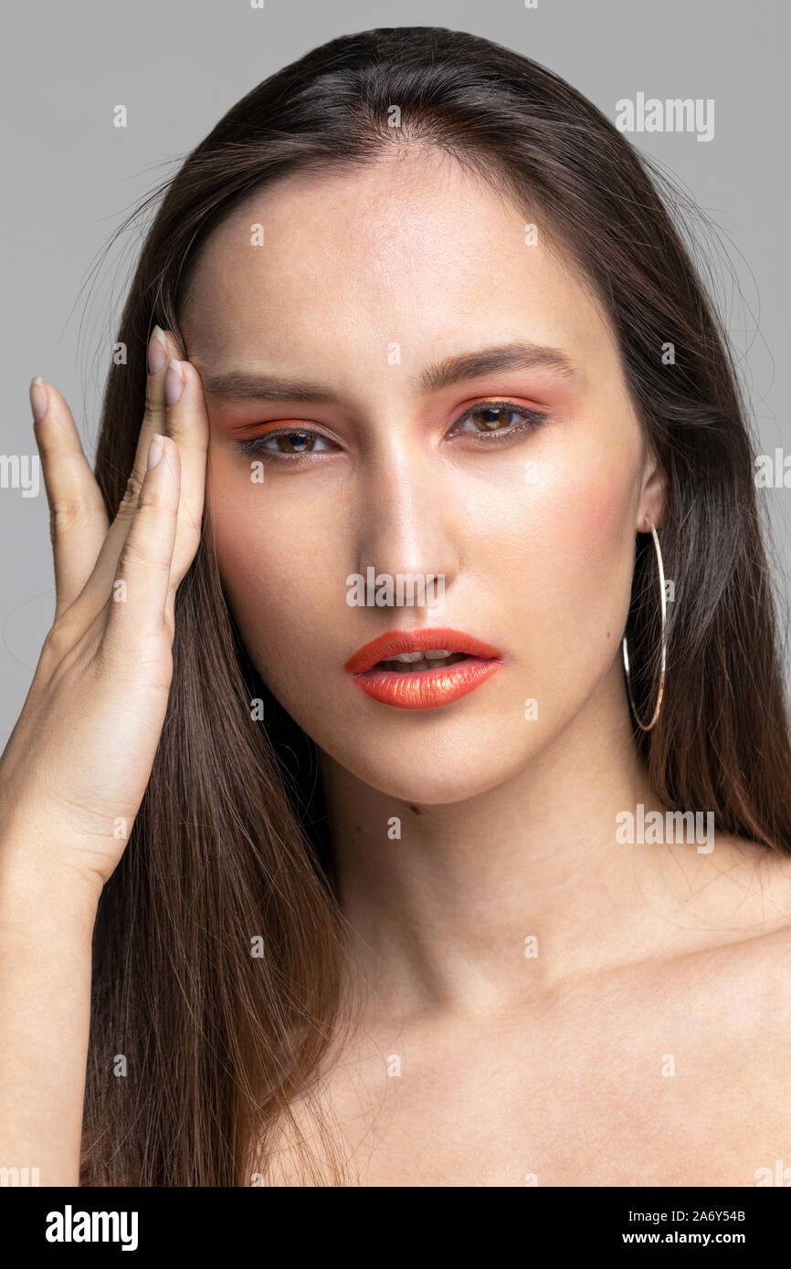 portrait of girl model with hand at his head Stock Photo - Alamy