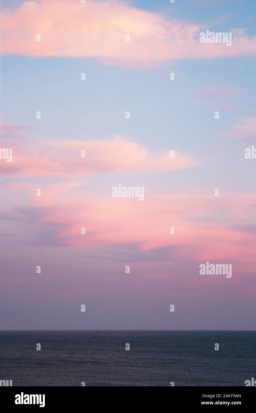 Sunset with clouds. Different shapes and colors Stock Photo - Alamy