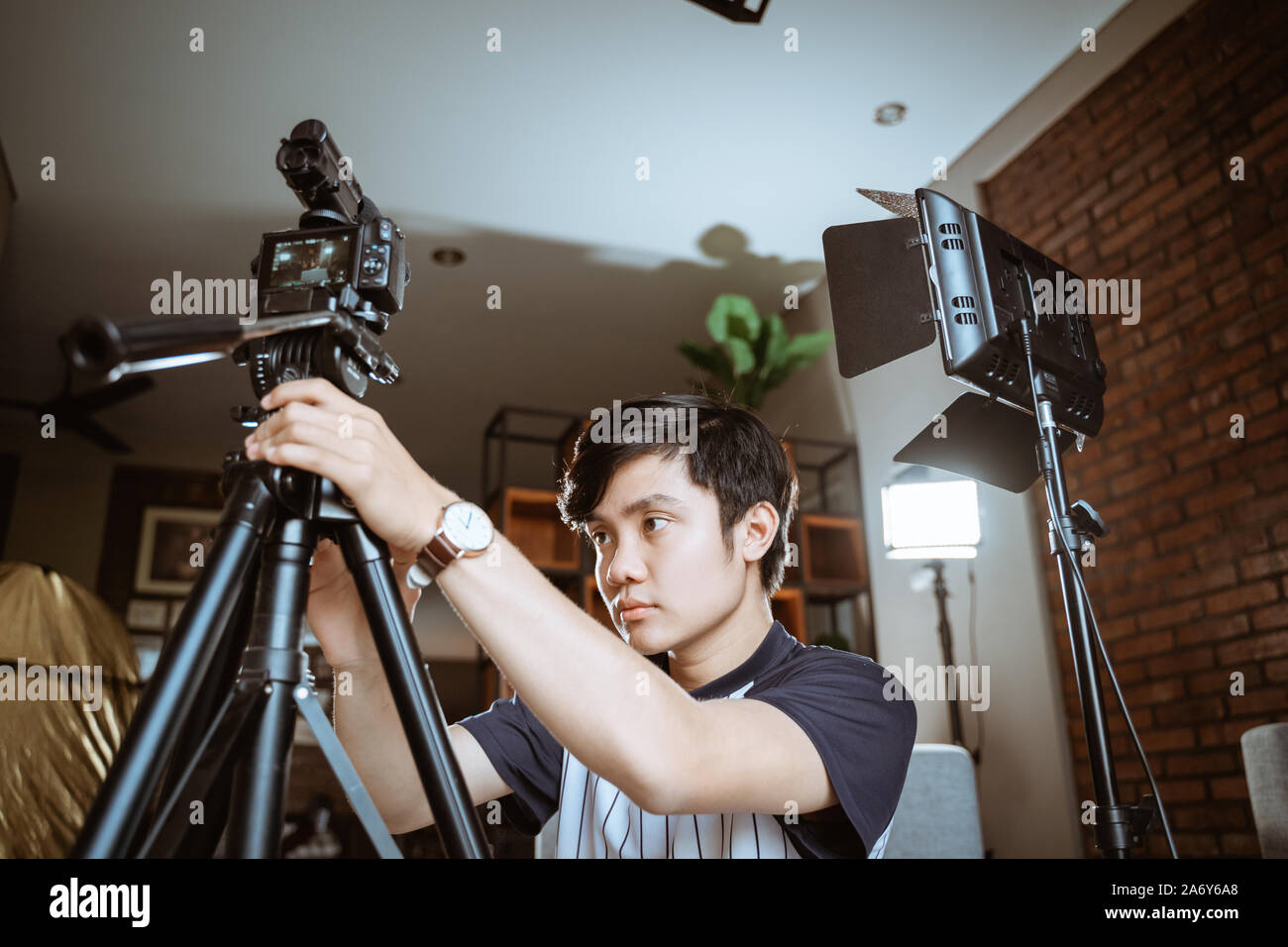 asian young man vlogger preparing camera to create their vlog Stock ...