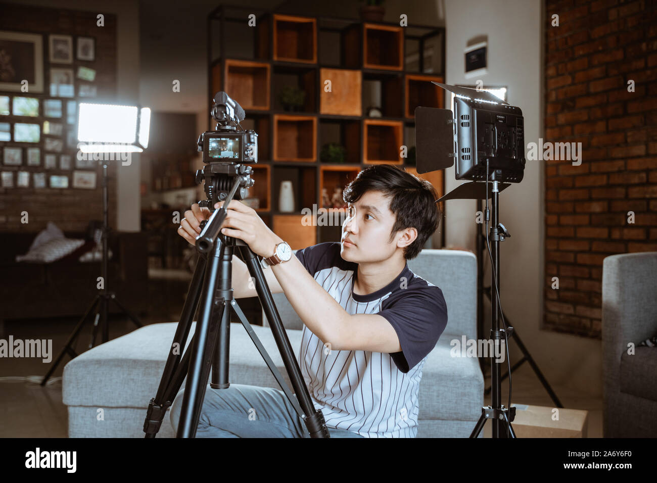 young man vlogger preparing camera to create their vlog Stock Photo - Alamy