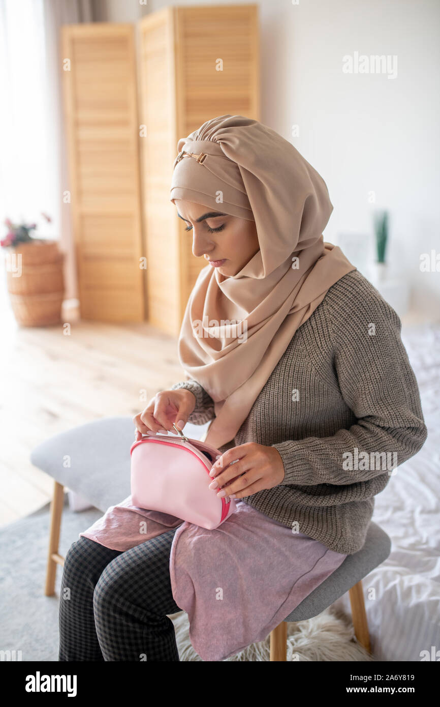 Stylish young girl getting ready to do makeup Stock Photo - Alamy