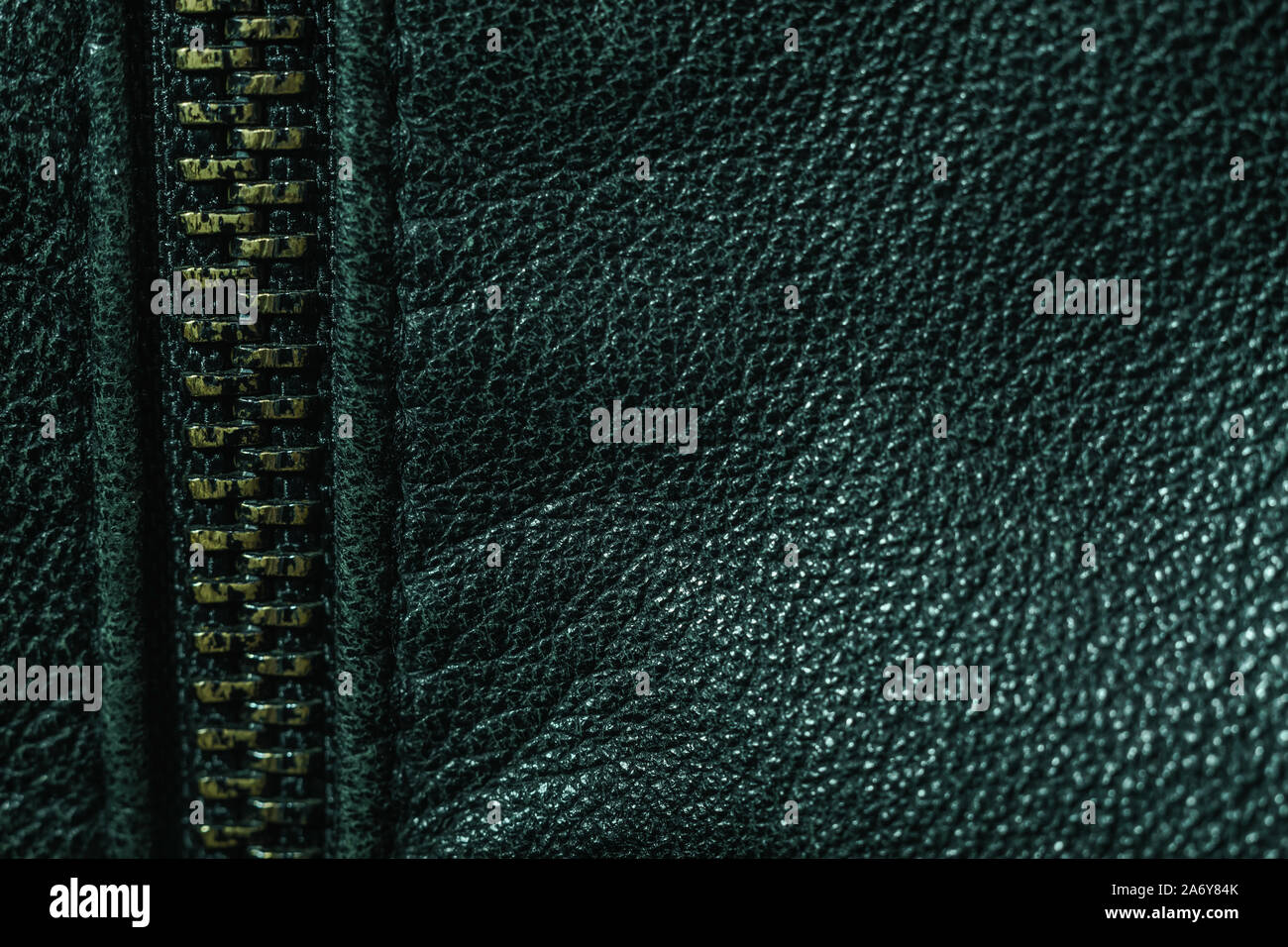 Close up beautiful zipper on natural black leather texture background ...