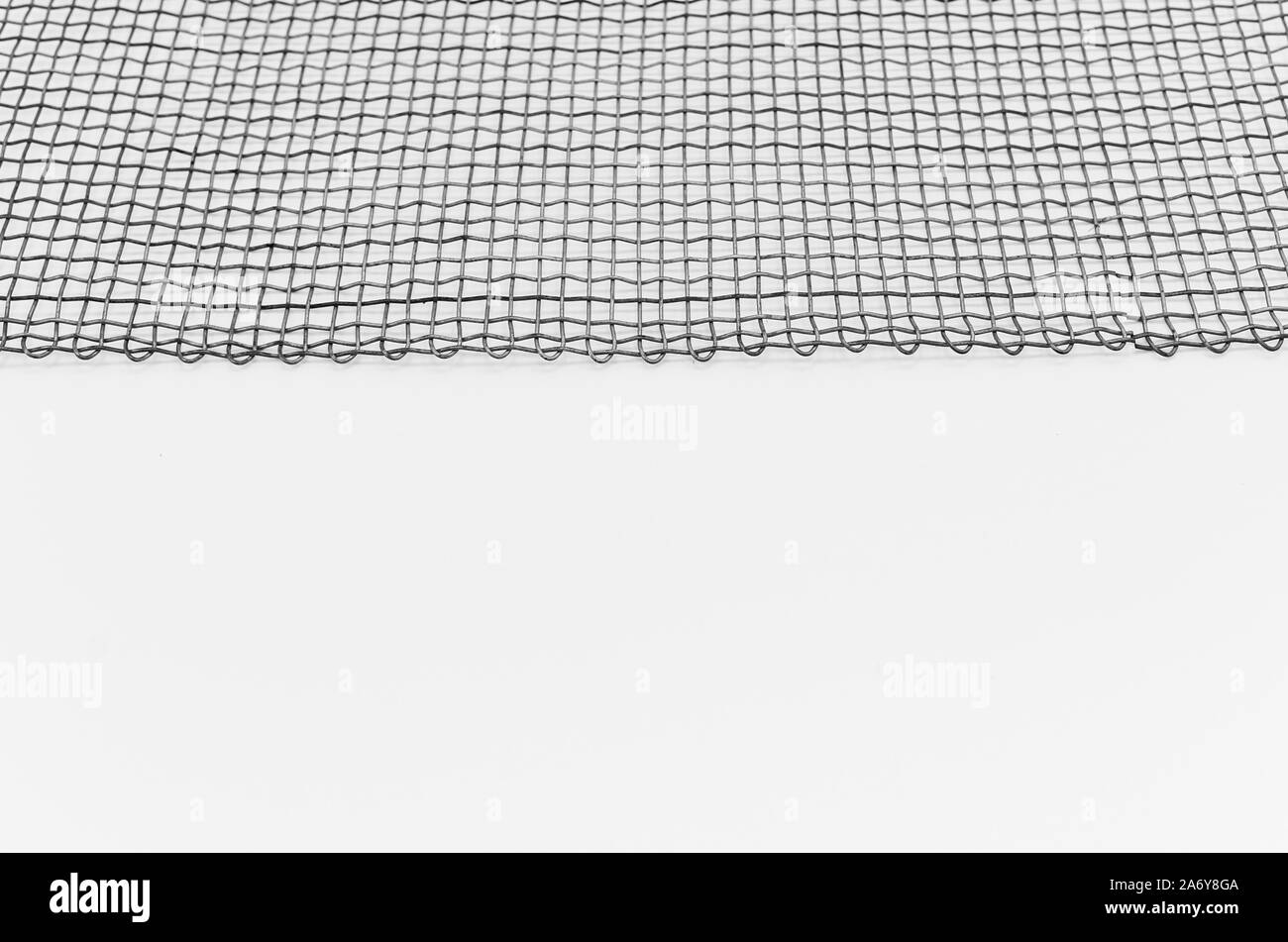 metallic mesh on a blank surface backdrop - objects and materials Stock ...