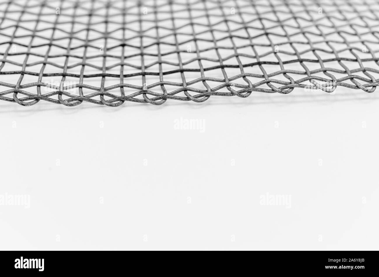 metallic mesh on a blank surface backdrop - objects and materials Stock ...