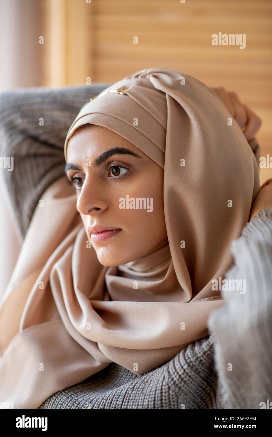 Young Muslim girl dressing up while getting ready for university Stock ...