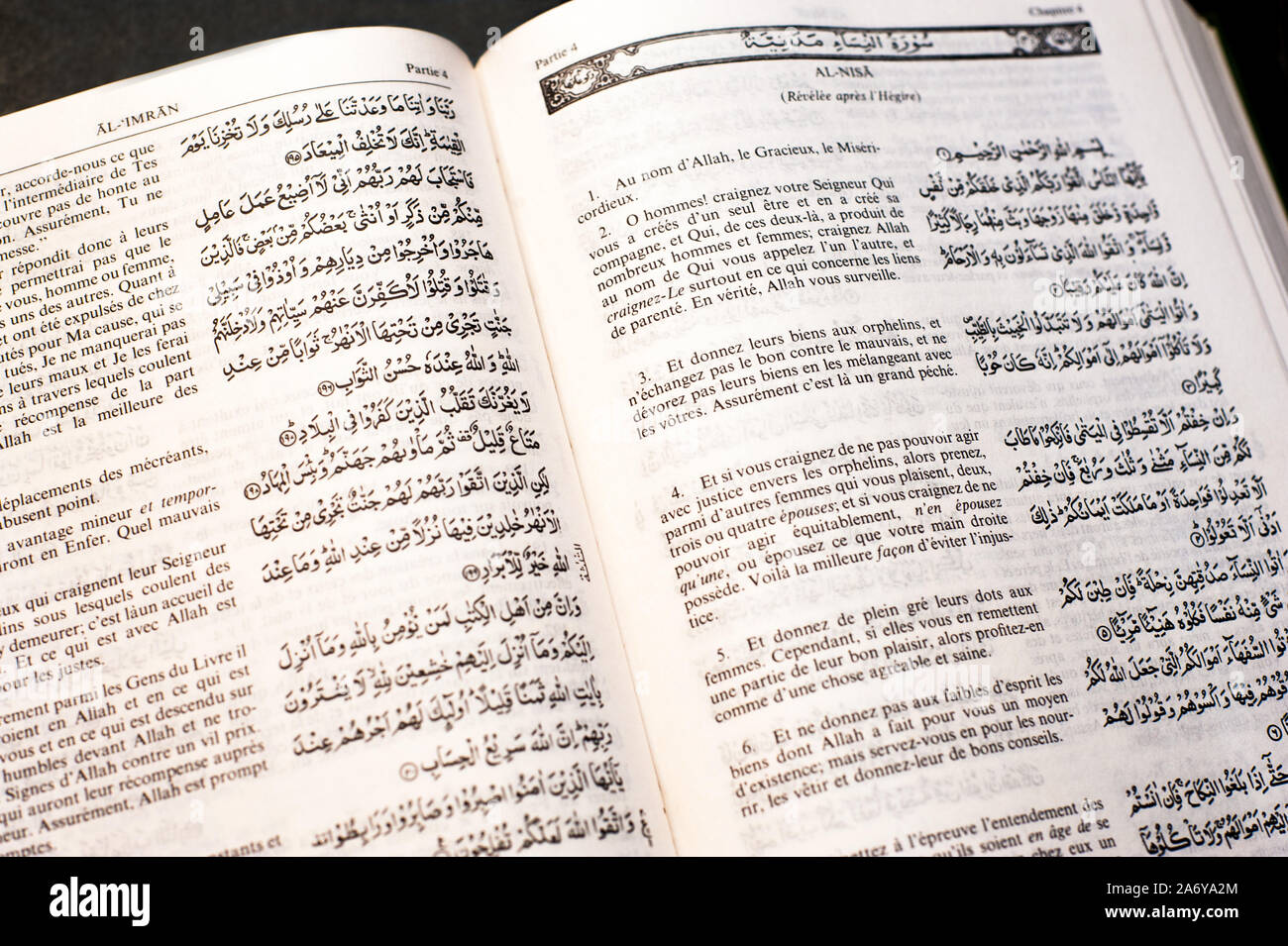 Koran written in arabic script and translated in french language Stock ...
