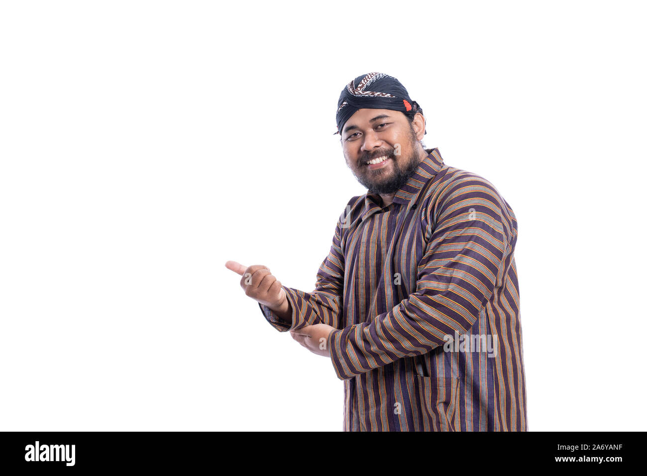 male with javanese traditional cloth lurik welcoming people Stock Photo ...