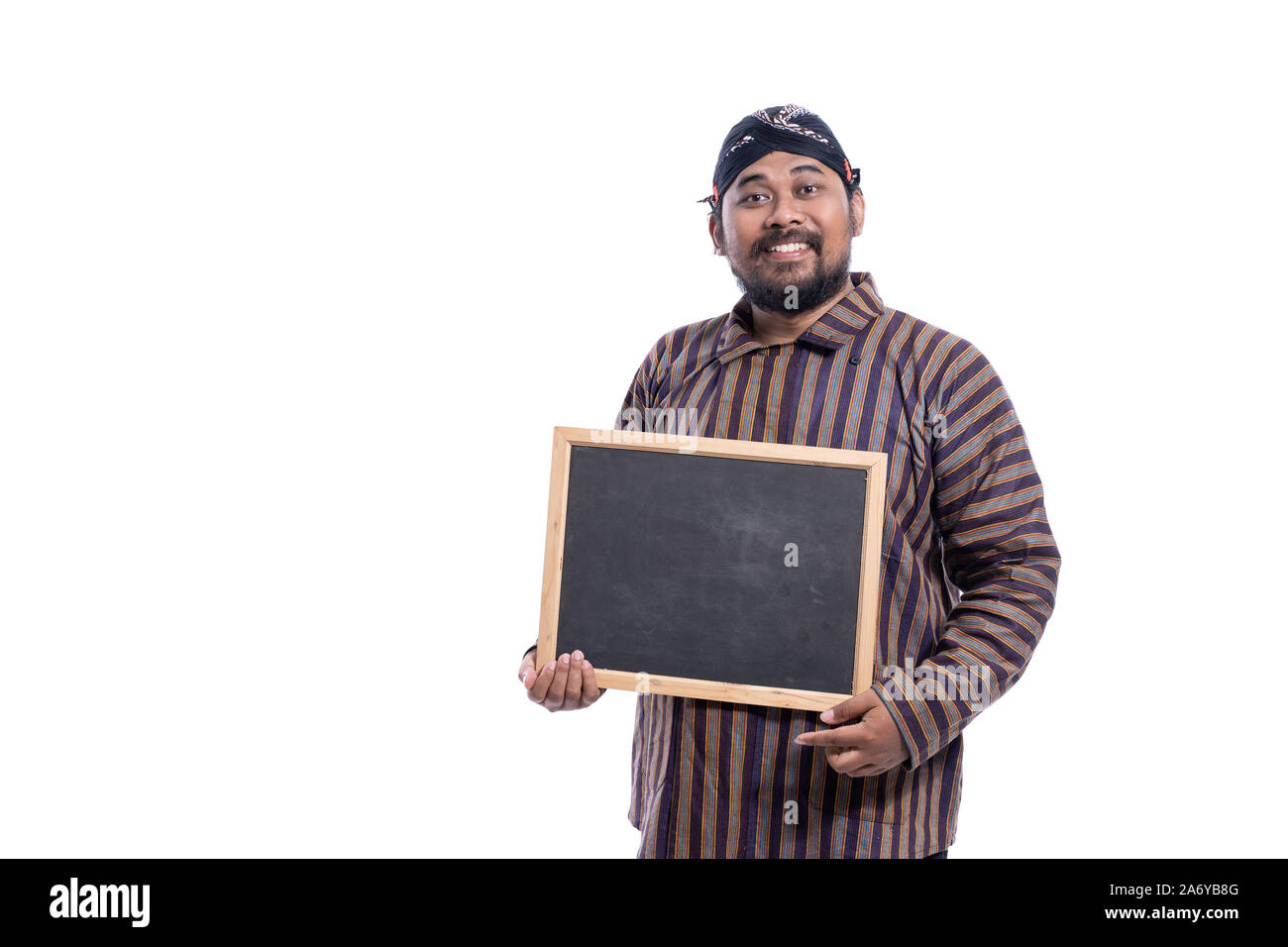 male with javanese traditional cloth lurik holding blacboard Stock ...