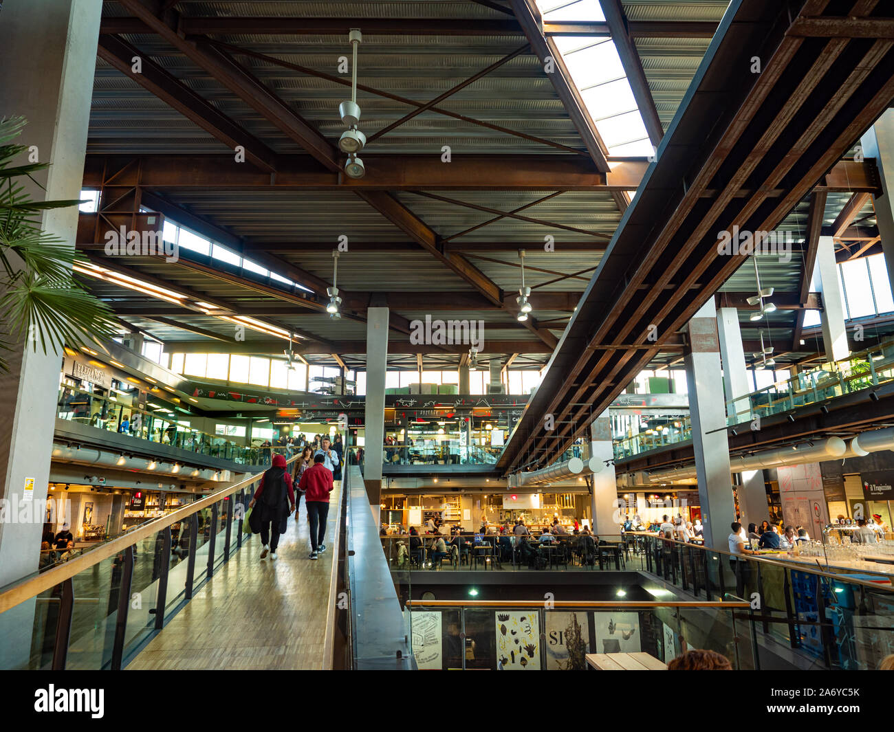 Modern interior of the new central market of Turin with shops and ...