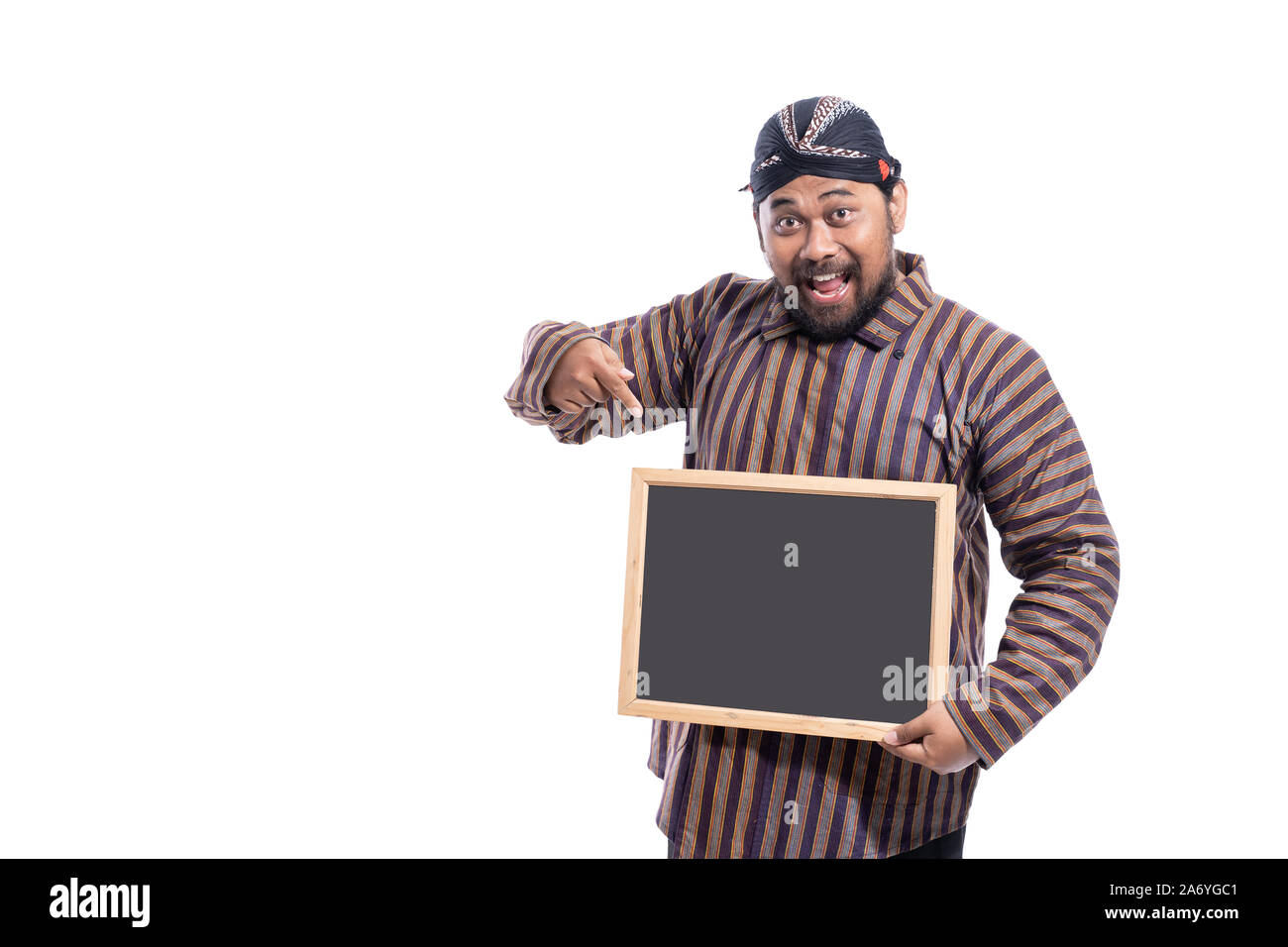 male with javanese traditional cloth lurik holding blacboard Stock ...