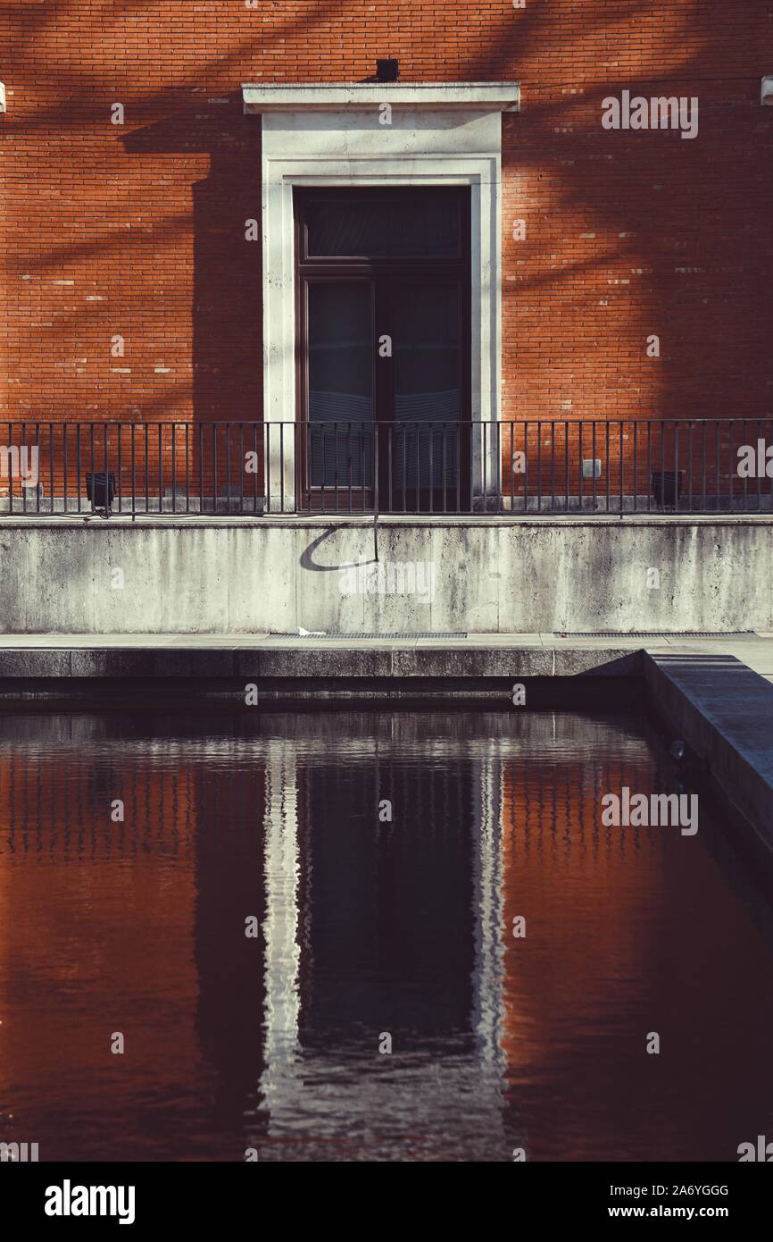 window on the red facade of the building in Bilbao city spain Stock ...