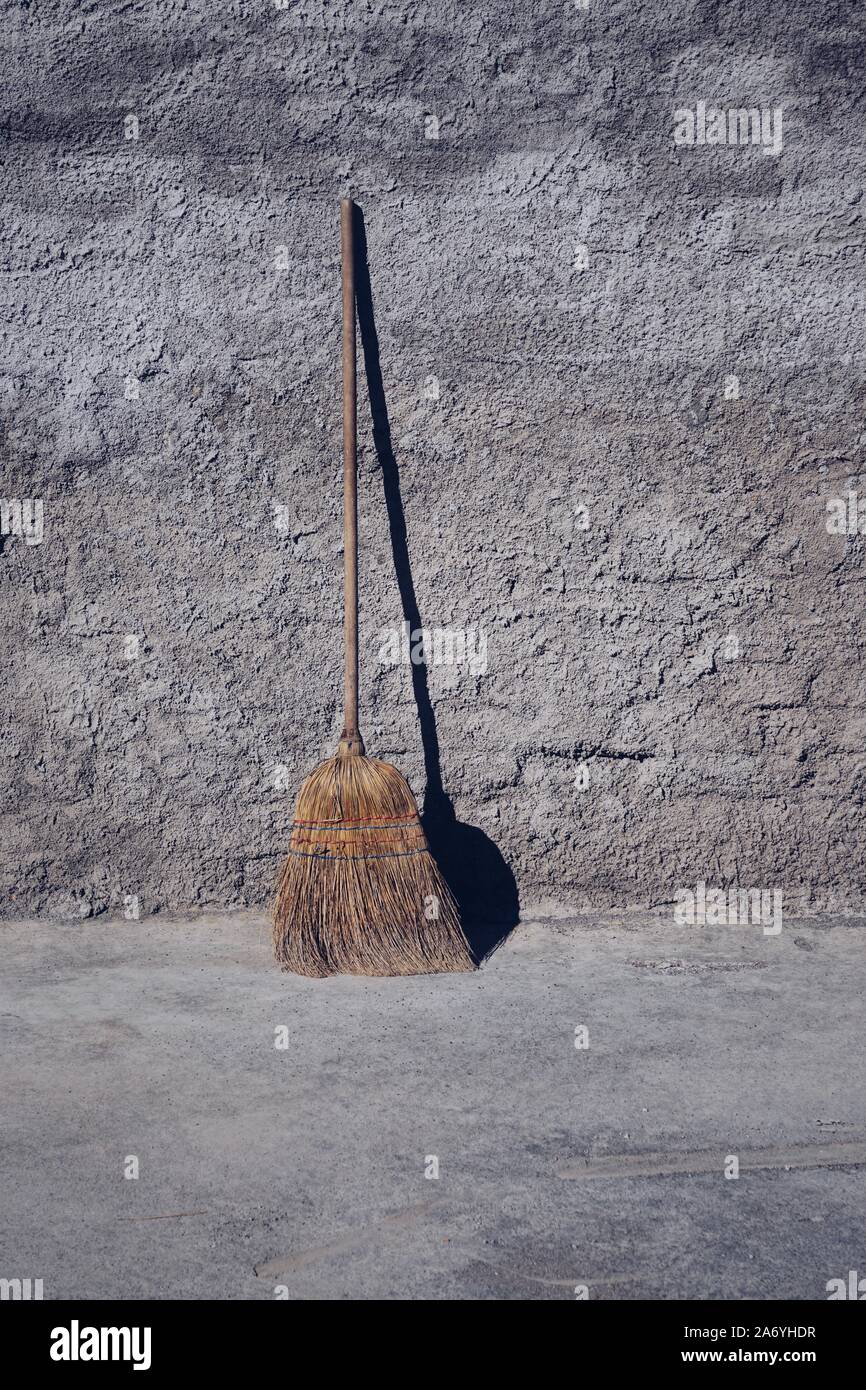 wooden broom on the wall on the street for cleaning the street Stock ...