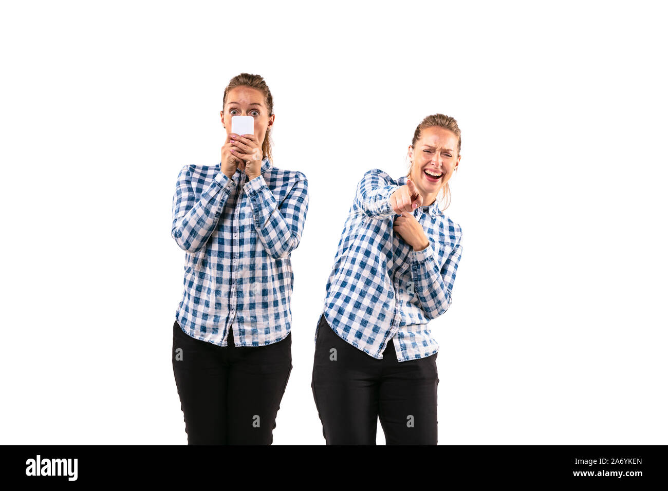 Young handsome woman arguing with herself on white studio background ...