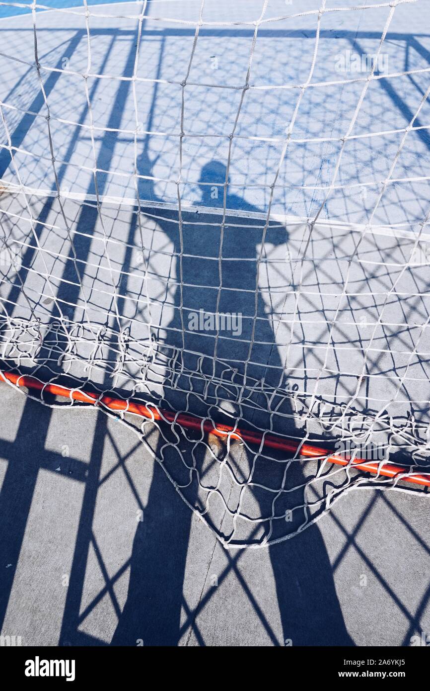 man shadow silhouette on the soccer field on the street Stock Photo - Alamy