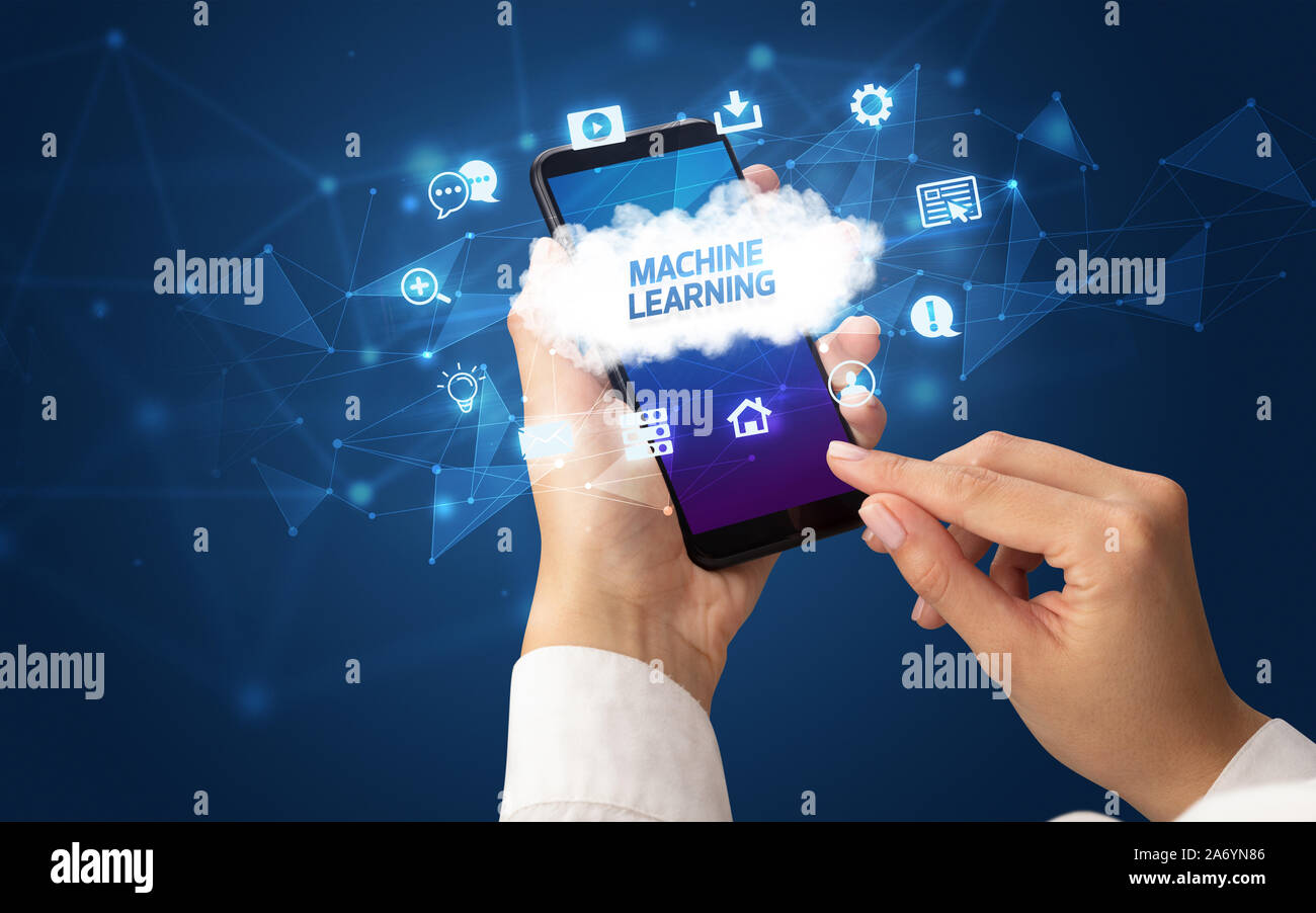 Female hand holding smartphone with MACHINE LEARNING inscription, cloud ...