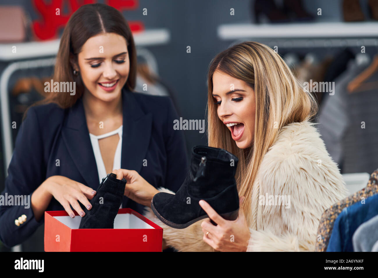 Woman with shop assistant hi-res stock photography and images - Alamy