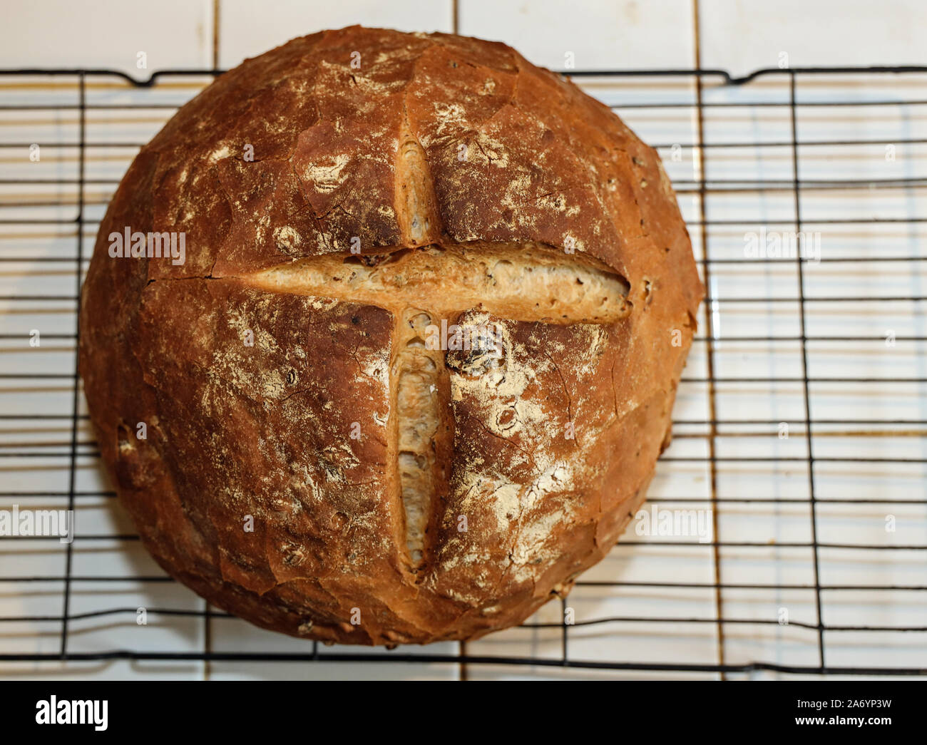 Loaf of walnut bread photographed on a rack from above Stock Photo - Alamy