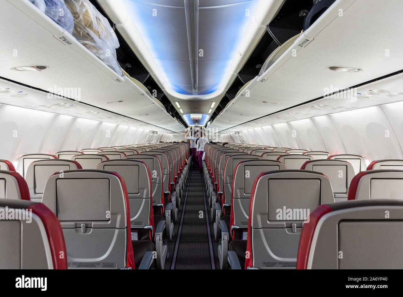 Airplane interior seats and aisle- travel concept Stock Photo - Alamy