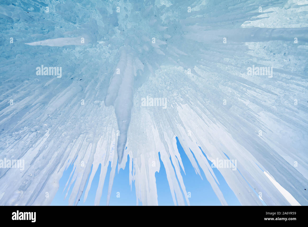 Lake Baikal is covered with ice and snow, strong cold, thick clear blue ...