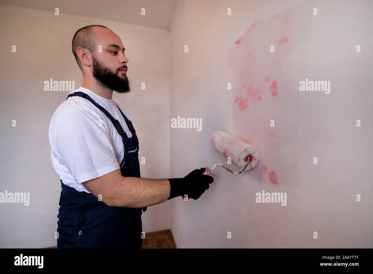 Construction worker doing finish renovation at apartment. Professional ...