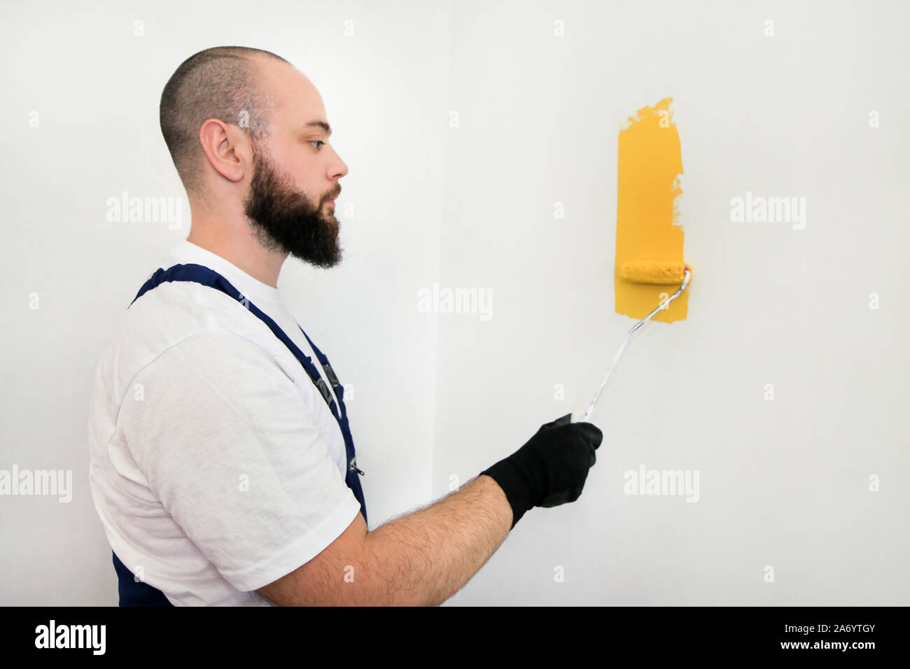 Construction worker and handyman doing finish renovation at apartment ...