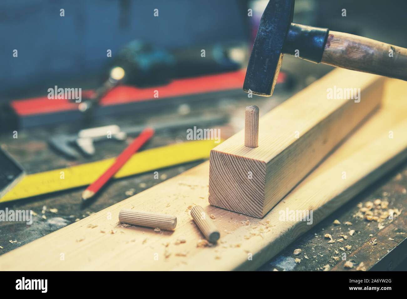 woodworking - making wooden dowel joint Stock Photo - Alamy