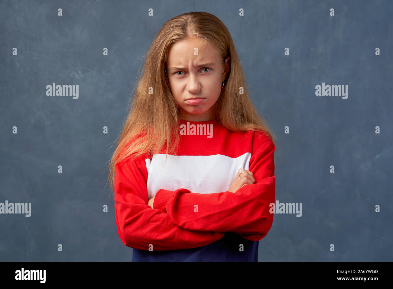 Unhappy teenager female model with displeased expression Stock Photo ...