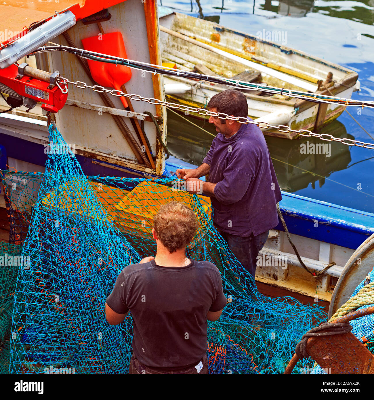 Repairing the Fishing Nets Stock Photo - Alamy