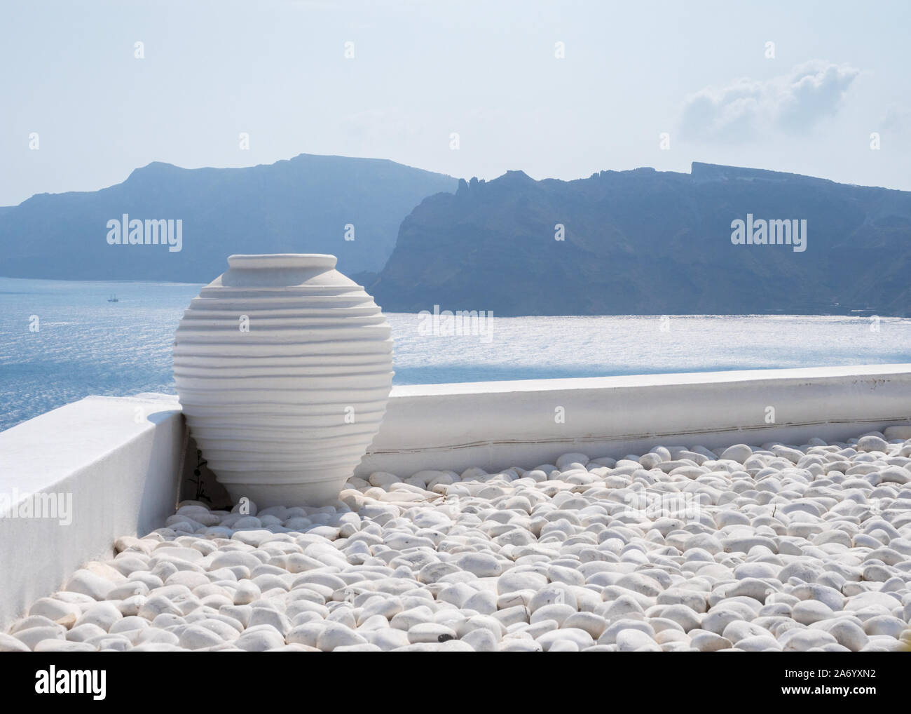 a white terracotta pot rings circles lines cobble cobbles stones ...