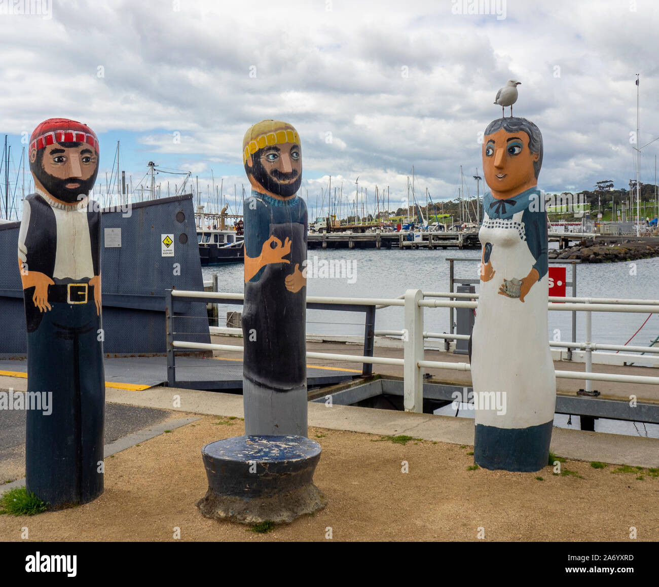 Baywalk bollard trail walk wooden sculptures of fishermen and wife by ...