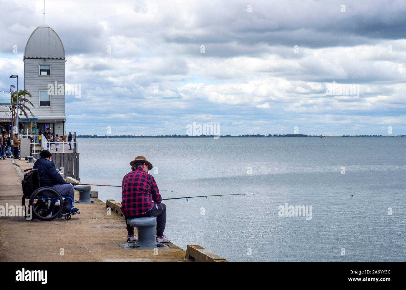 Two men rising from Cunningham Pier Corio Bay Geelong Victoria ...