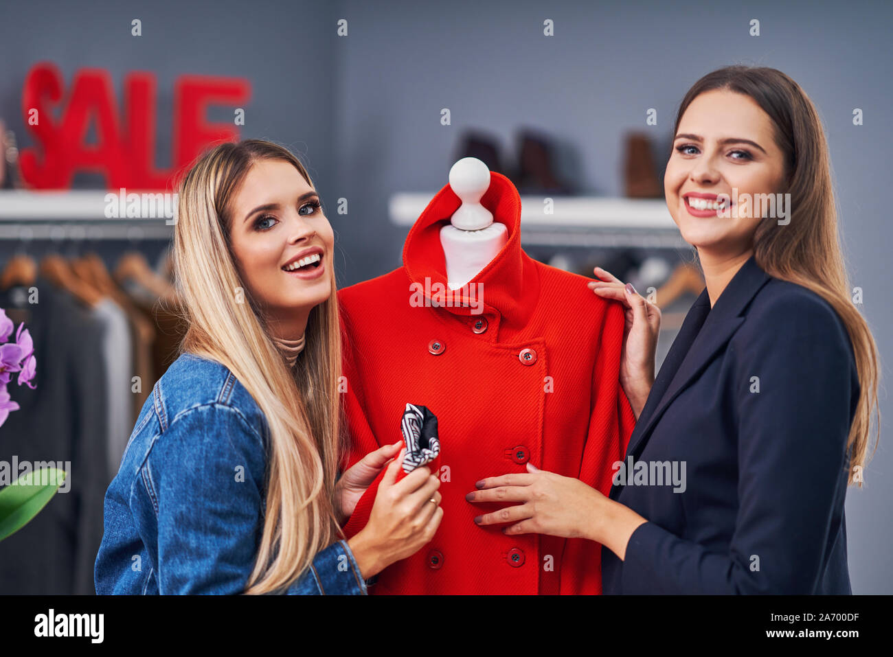 Fashion designer assisting the customer in clothes boutique Stock Photo ... Fashion designer assisting the customer in clothes boutique Stock Photo ...
