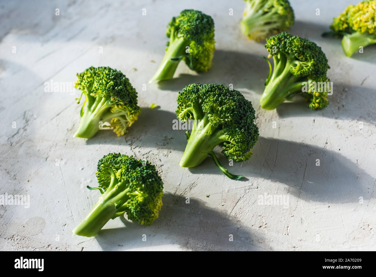 fresh healthy broccoli on a light background Stock Photo - Alamy