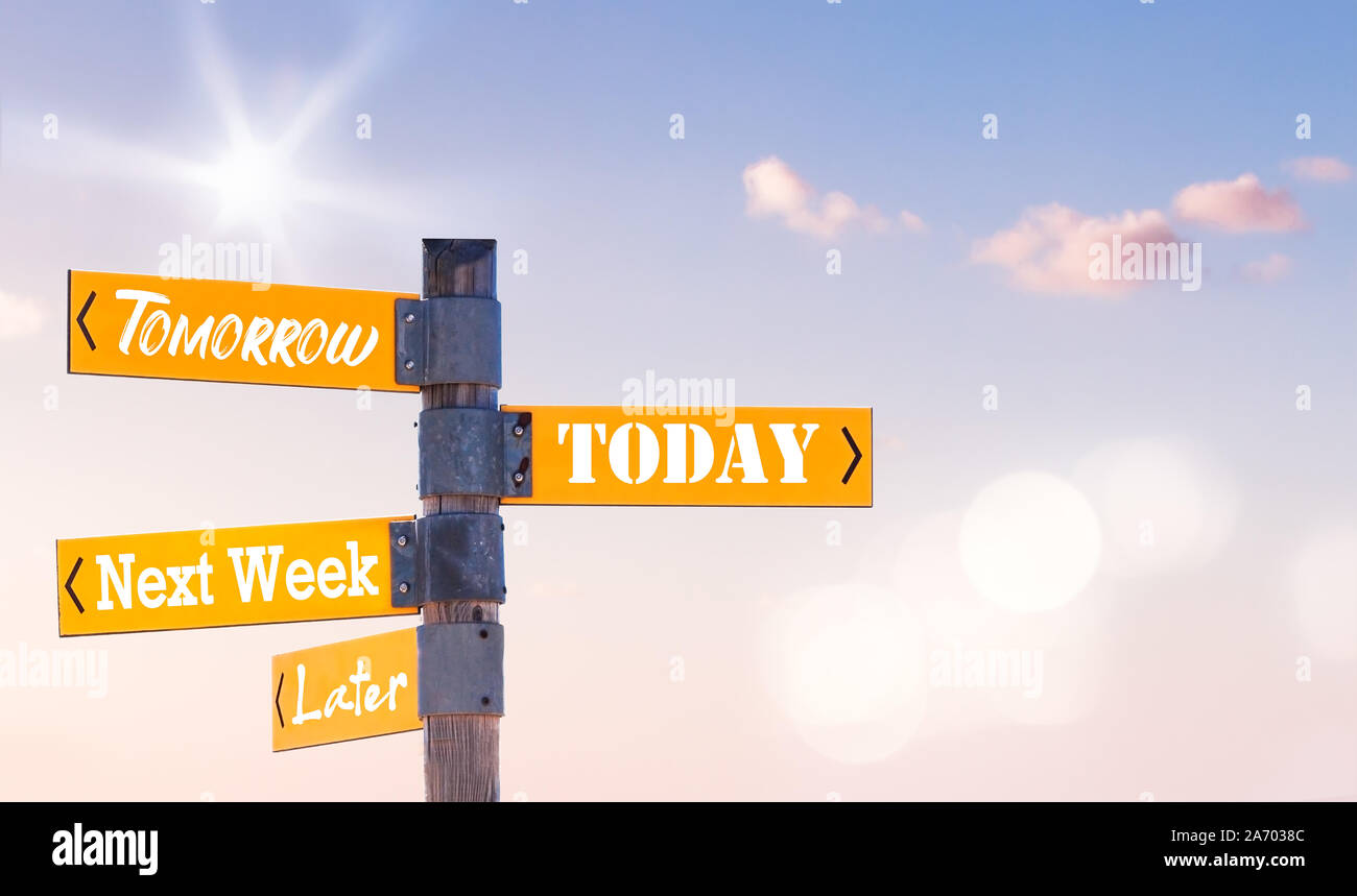 The Words Today, Tomorrow, Later and Next Week written on a Signpost ...