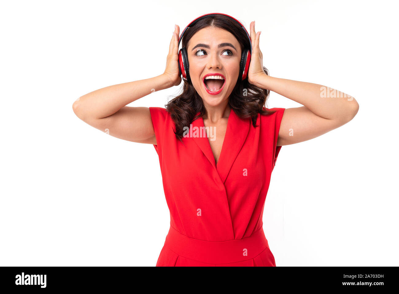 happy girl smiles broadly on a white background, stylish lady in a red ...