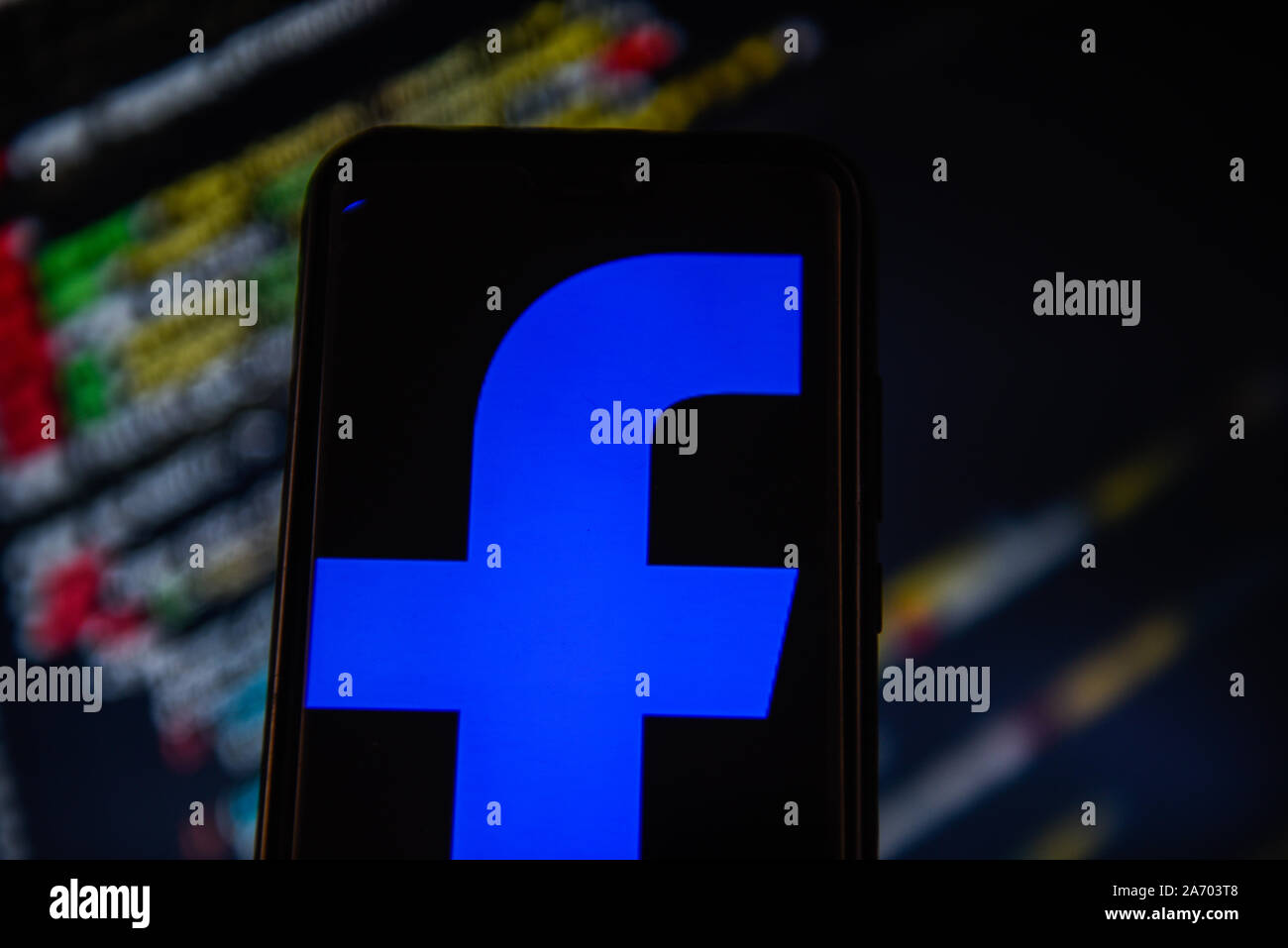 In this photo illustration a Facebook logo displayed on a smartphone ...